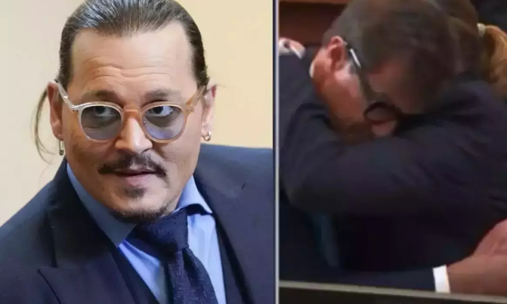 After closing arguments, Johnny Depp hugs his lawyer view